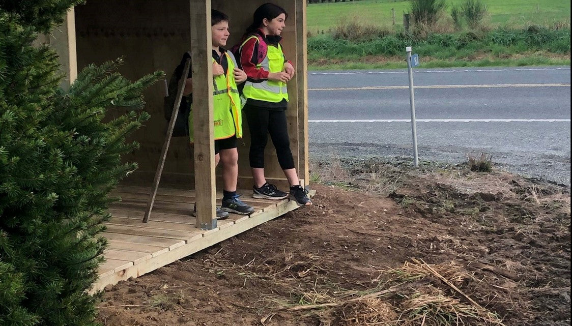 Wood Shed used as Kids Bus Stop Shelter